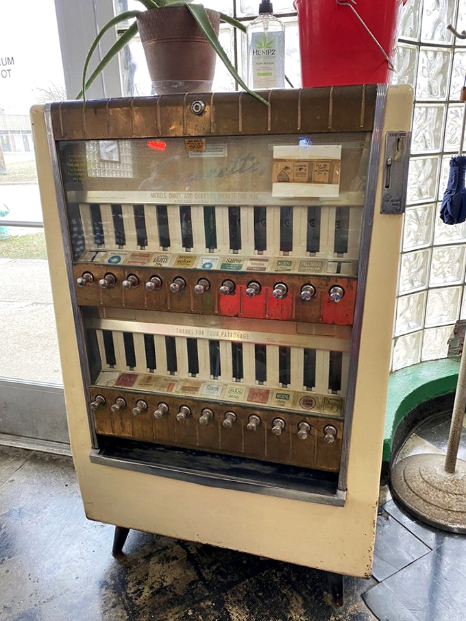 A vintage cigarette machine stands as a nostalgic sentinel from another era, when smoking sections and rotary phones ruled the land.