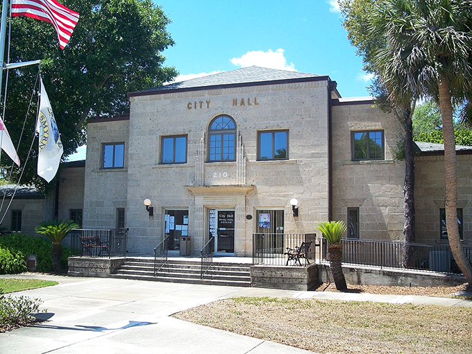 City Hall's dignified presence anchors the community with old Florida charm. Where small-town governance happens with palm trees standing guard.