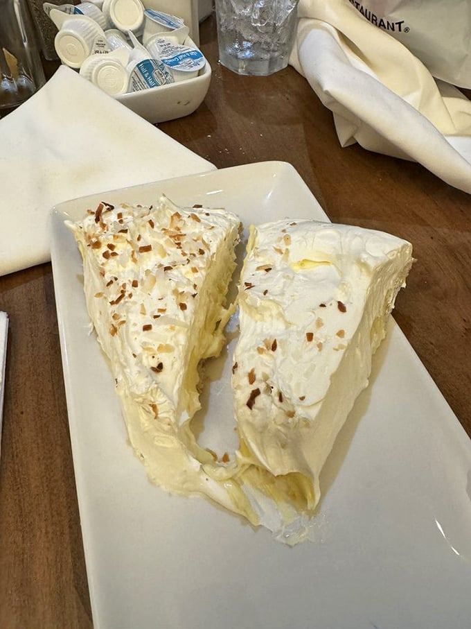 Coconut cream pie so light it might float away if not anchored by that perfect crust. Two slices means double the joy.