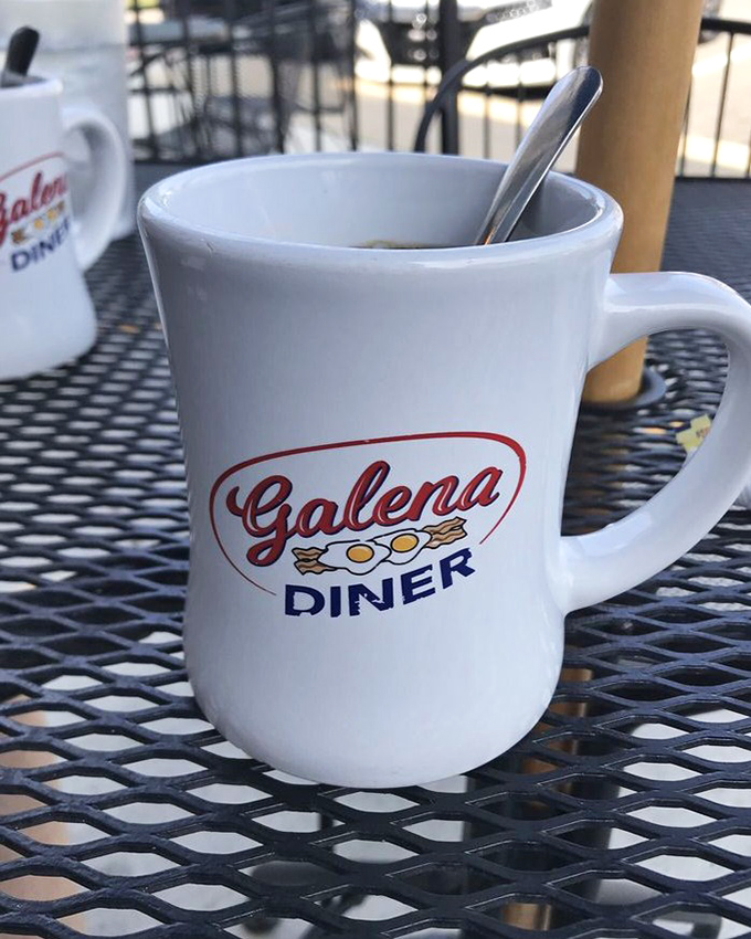 The humble coffee mug, branded with pride, ready to deliver that life-giving elixir that makes morning conversations possible. 