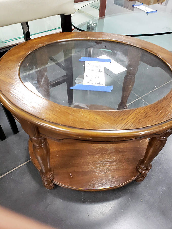 Solid wood and glass with stories to tell. This coffee table has probably held everything from fancy hors d'oeuvres to college textbooks.