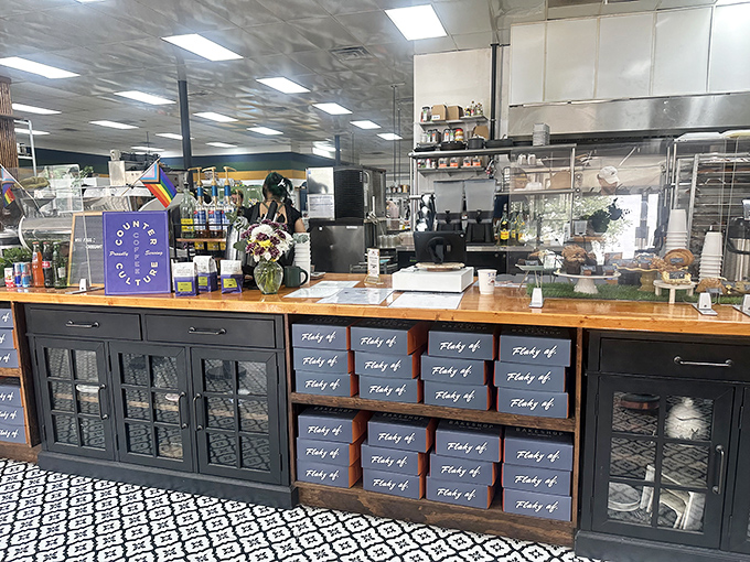 Behind the counter, boxes labeled "Flaky AF" tell you everything you need to know about the bakery's commitment to truth in advertising.