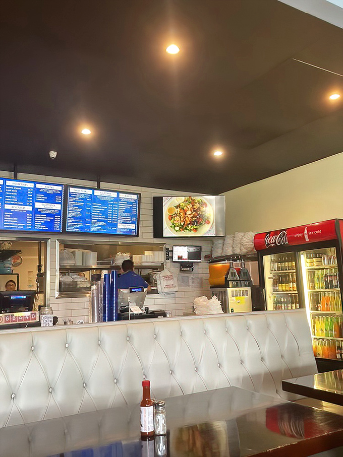 The counter view&mdash;where anticipation builds as you watch your order being prepared against a backdrop of gleaming white tiles.