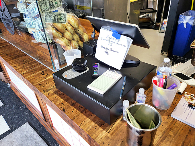 The ordering counter where barbecue destiny awaits. That wooden countertop has witnessed countless moments of anticipation and subsequent joy.