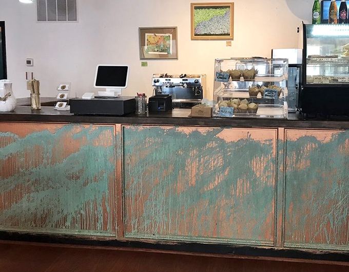 The counter's weathered turquoise patina tells stories of countless coffee refills and "just one more biscuit" negotiations over the years.
