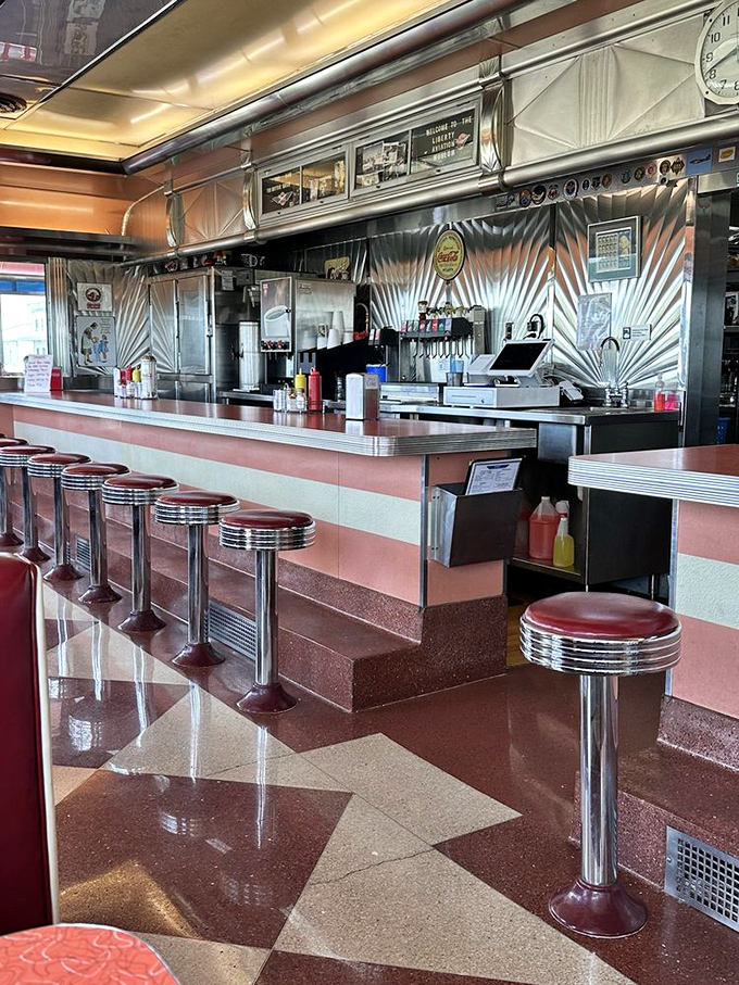 The counter beckons with its row of red stools&mdash;each one a front-row seat to the sizzling symphony of short-order cooking at its finest.