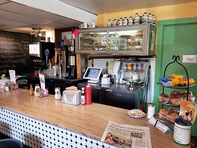 The counter experience: where regulars perch on stools, watching culinary choreography while pastries tempt from beneath glass domes.