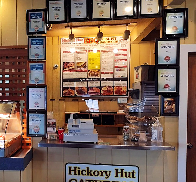 Award certificates frame the ordering counter like a shrine to smoke-mastery, each one a testament to consistency and dedication.