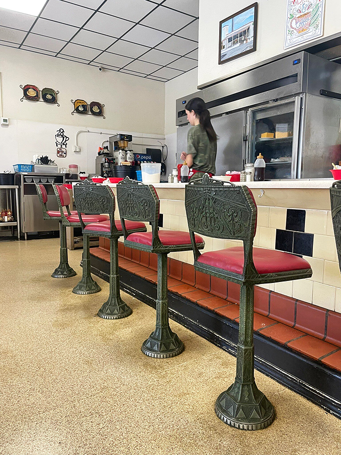 These vintage counter seats have witnessed decades of coffee refills, morning papers, and the kind of conversations that make small-town America feel like home.