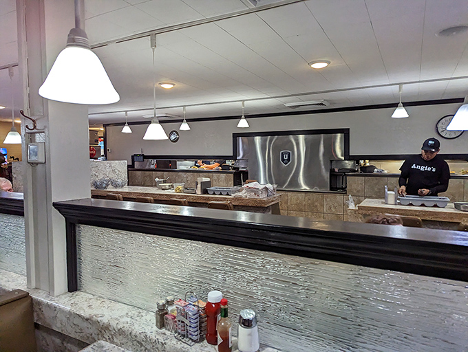 Behind this counter, breakfast dreams become reality. The stainless steel backdrop sets the stage for morning magic to unfold.
