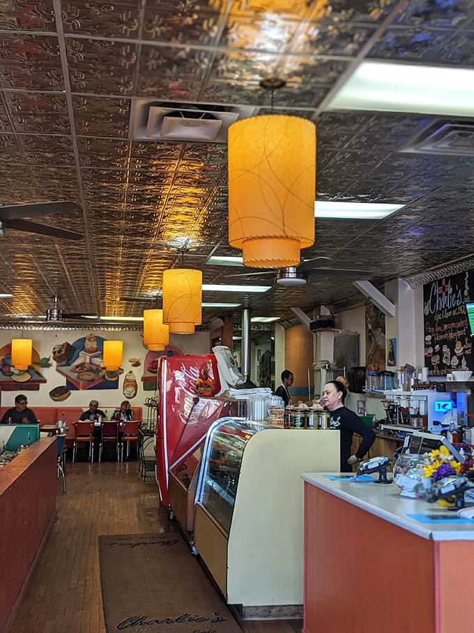 The counter area glows with vintage charm where coffee flows and conversations happen between neighbors and new friends.