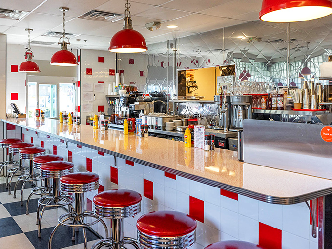 That counter stretches invitingly, complete with chrome stools and condiments at the ready for whatever culinary adventure you choose.