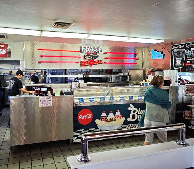The counter area gleams with promise, its neon signs and vintage details creating the backdrop for ice cream dreams and fountain favorites.