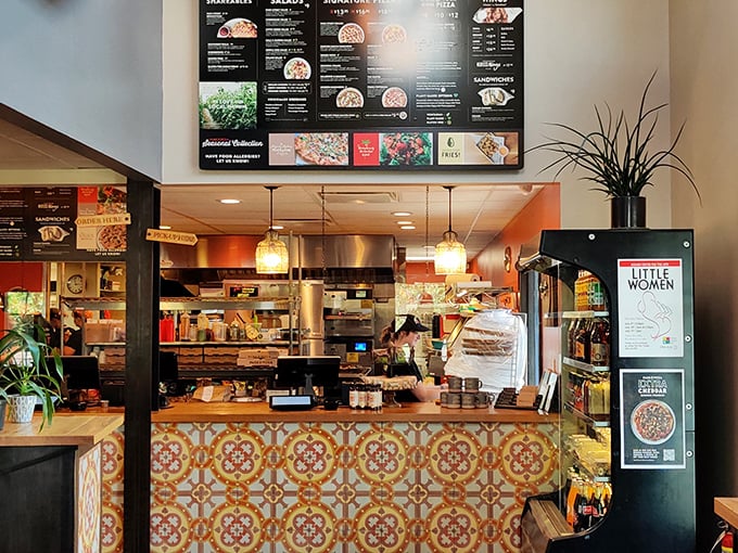 The counter where pizza dreams come true, complete with vintage-inspired tiles that would make any designer swoon.