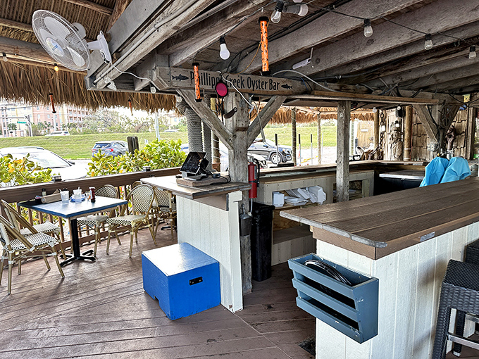 The rustic check-in counter welcomes you like an old friend &ndash; thatched roof overhead, blue tables beckoning, and Florida sunshine streaming in.