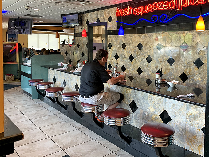 Counter seating with a view of the action &ndash; dinner theater at its finest.
