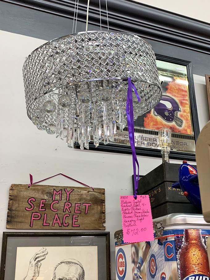 Beneath this crystal chandelier and "My Secret Place" sign lies a collector's paradise of sports memorabilia&mdash;where fandom meets decoration.