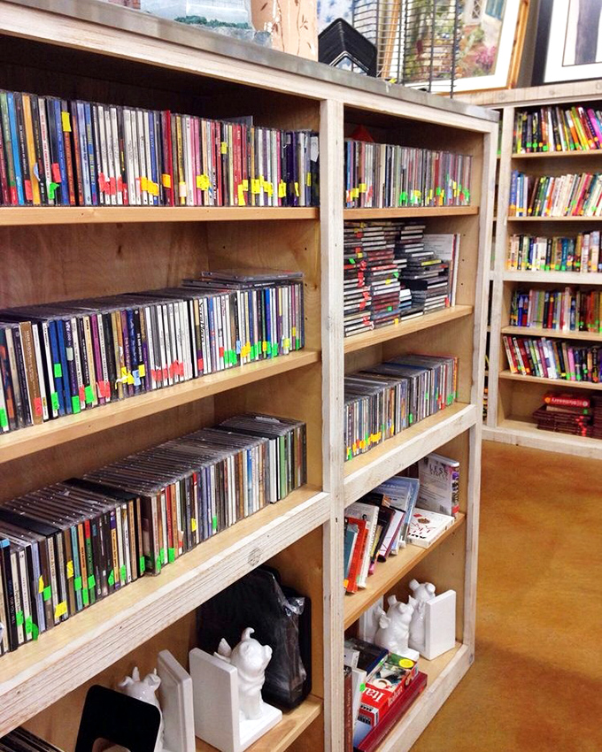 Media heaven for the digitally nostalgic. These shelves hold forgotten blockbusters and cult classics, each disc a $2 ticket to movie night nostalgia.