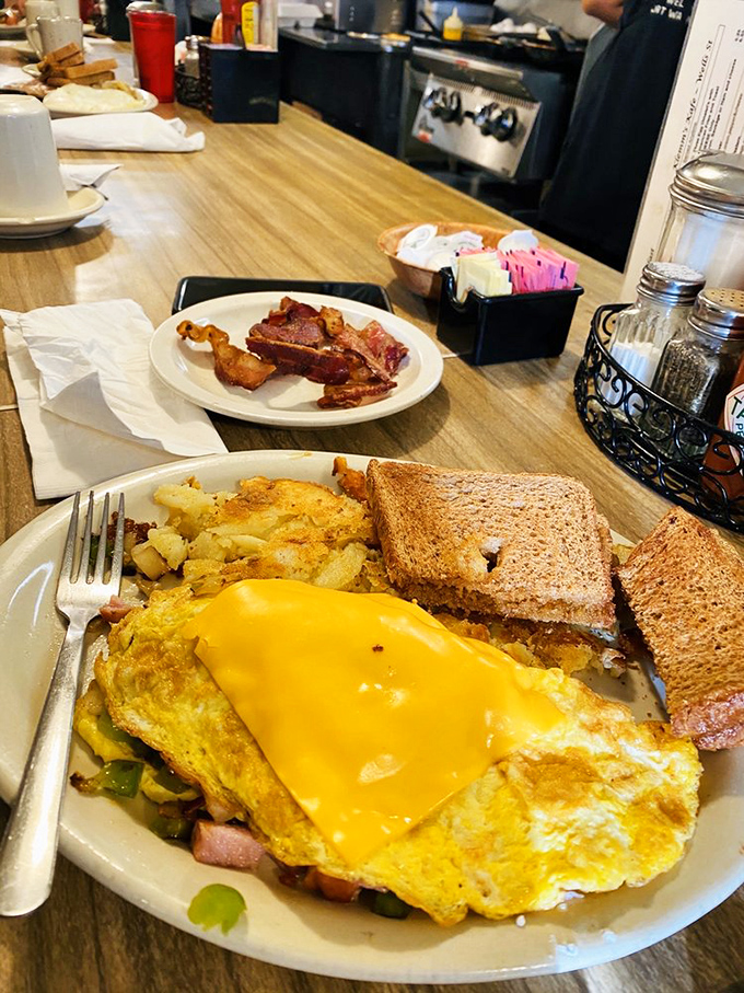 The Denver omelet&mdash;where eggs provide a golden canvas for ham, peppers, and onions to show off their morning dance skills.