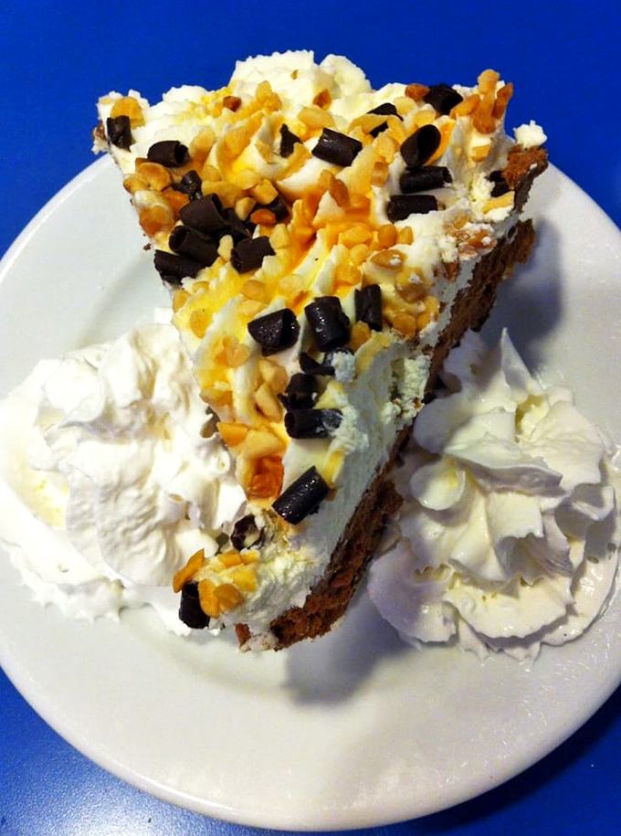 A slice of pie that makes you reconsider your relationship with dessert. With whipped cream islands floating alongside, it's a sweet dream realized.