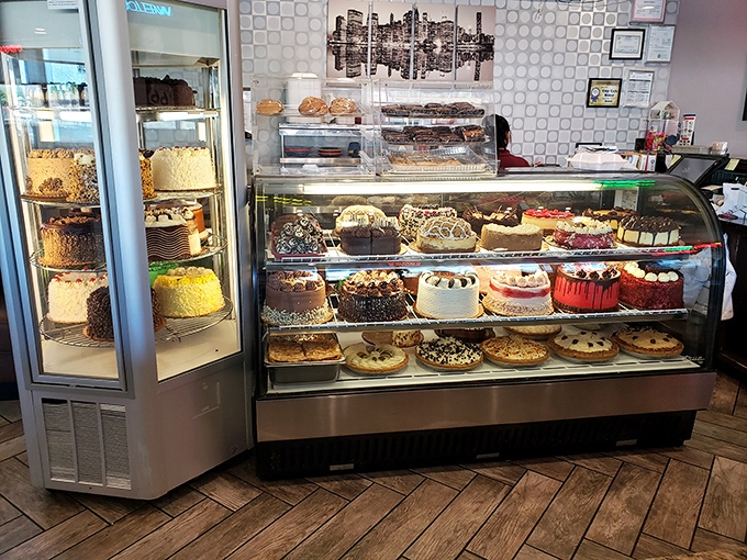 The dessert case that stops conversations mid-sentence—a glass-enclosed wonderland of cakes, pies, and pastries that makes choosing just one a delicious dilemma.