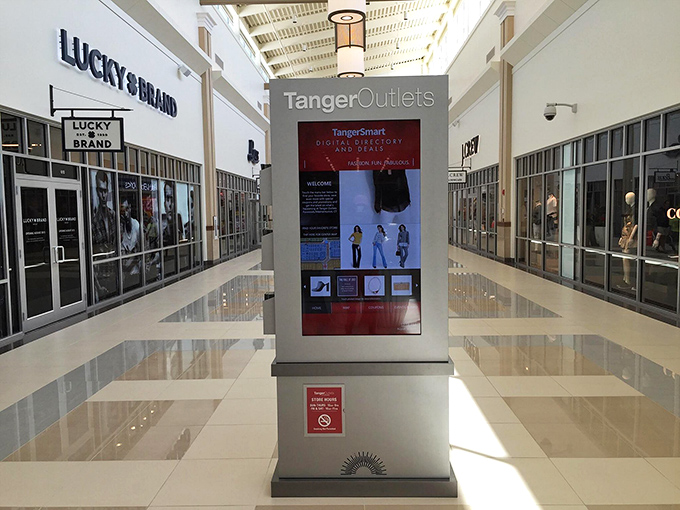 The digital directory stands like a retail lighthouse in a sea of shopping options. Technology saving us from ourselves since... well, sometimes.