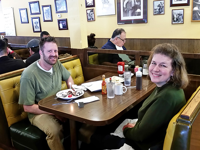 Happy diners in their natural habitat – the universal expression of "I made an excellent food decision today" captured perfectly.