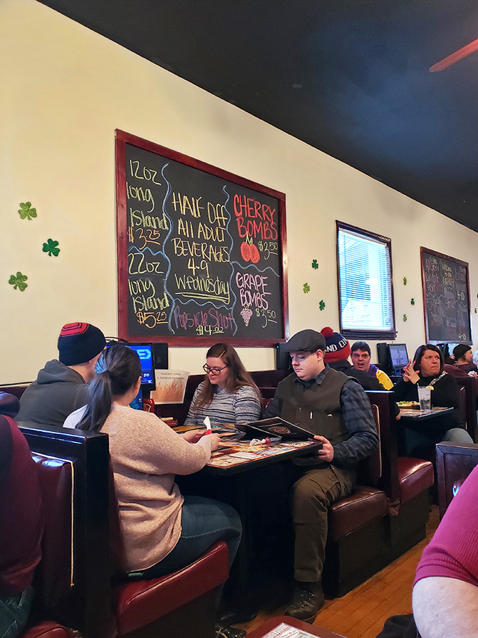 Locals gather around tables like they're campfires, sharing stories and menu recommendations with equal enthusiasm under the watchful eye of drink specials.