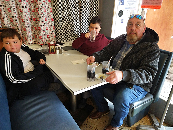 Three generations sharing sodas and stories&mdash;the true magic of places like Porky's isn't just on the plate, it's around the table.