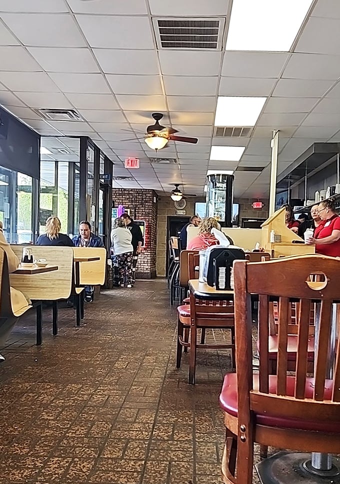 The dining room hums with the energy of regulars and first-timers alike, all united in the universal language of "pass the syrup."