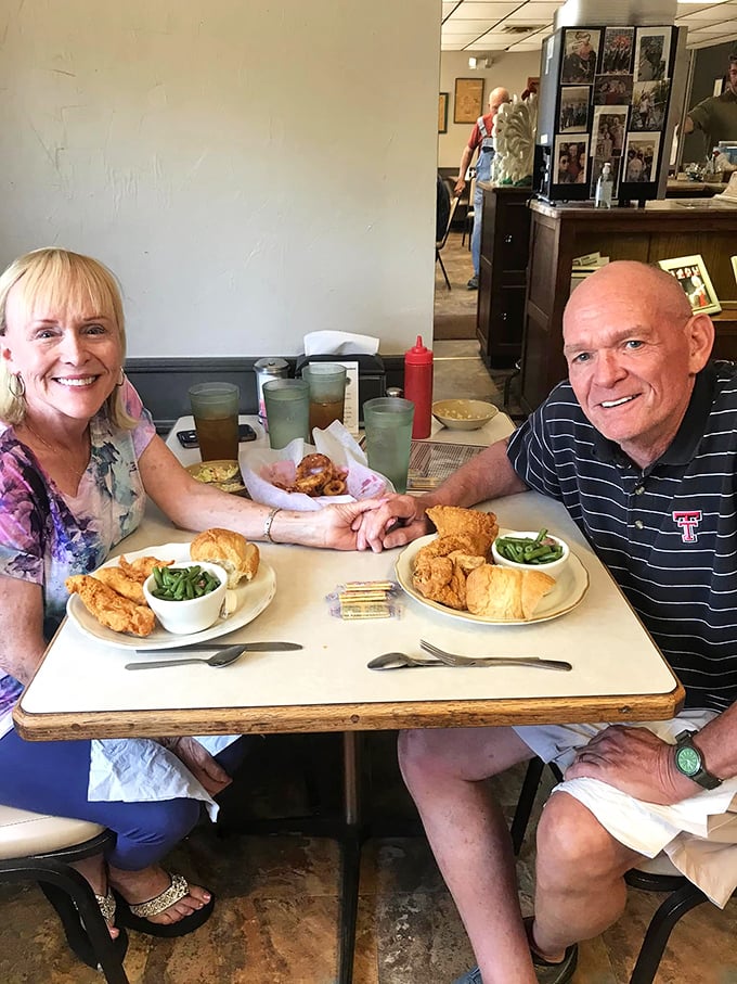 Happy diners enjoying the fruits of Olpe's culinary magic. Those smiles tell you everything you need to know.