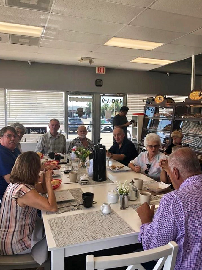 The true measure of a local gem: a table of regulars, gathered like a breakfast club, sharing stories over coffee and German-inspired delights.