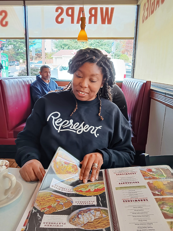 The red vinyl booths aren't just seating &ndash; they're front-row tickets to the greatest show on earth: watching other people's food arrive while you wait for yours.