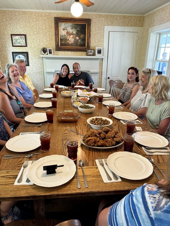 Strangers become friends around this communal table where passing dishes creates bonds stronger than some family reunions.