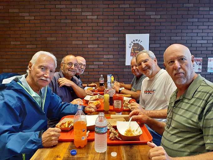 Good food brings people together. These diners know they've found a special spot worth sharing with friends and commemorating with smiles.