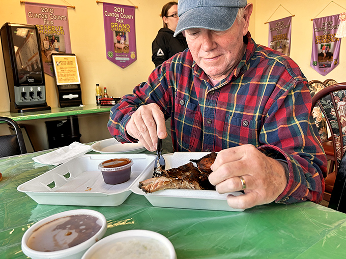 Every great BBQ joint has its devoted regulars. This gentleman knows the proper way to savor ribs&mdash;with focus and appreciation.