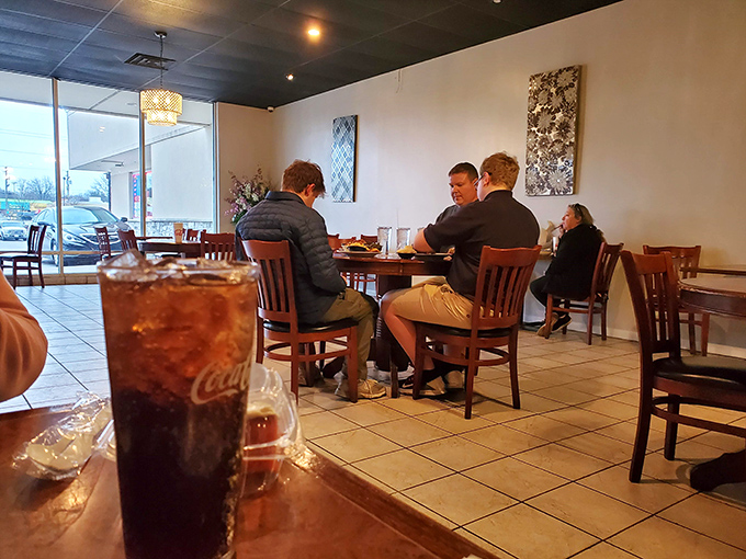 Where strangers become friends over shared appreciation of honest cooking. That sweet tea in the foreground is practically a supporting character.