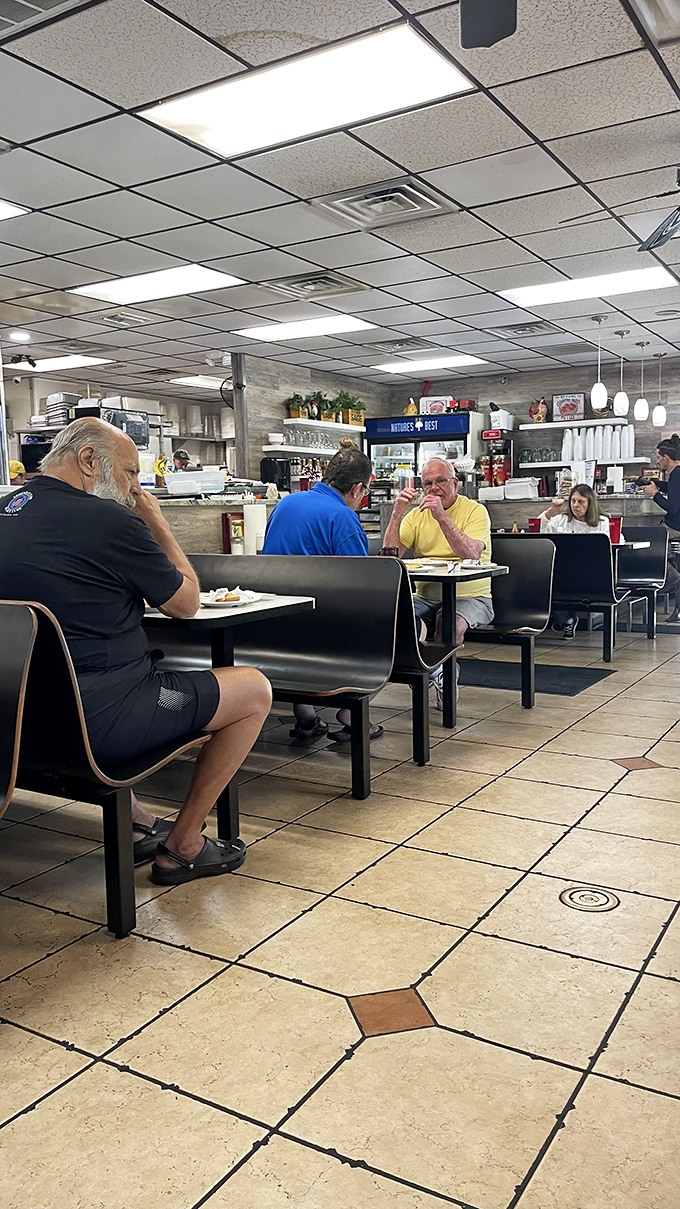 These aren't just diners; they're regulars performing their daily ritual of good food and better conversation in their natural habitat.