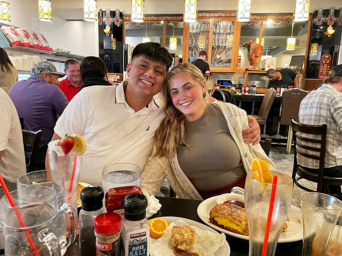 Happy diners sharing a moment of breakfast bliss. Their expressions say what words can't&mdash;this place delivers on its promises.