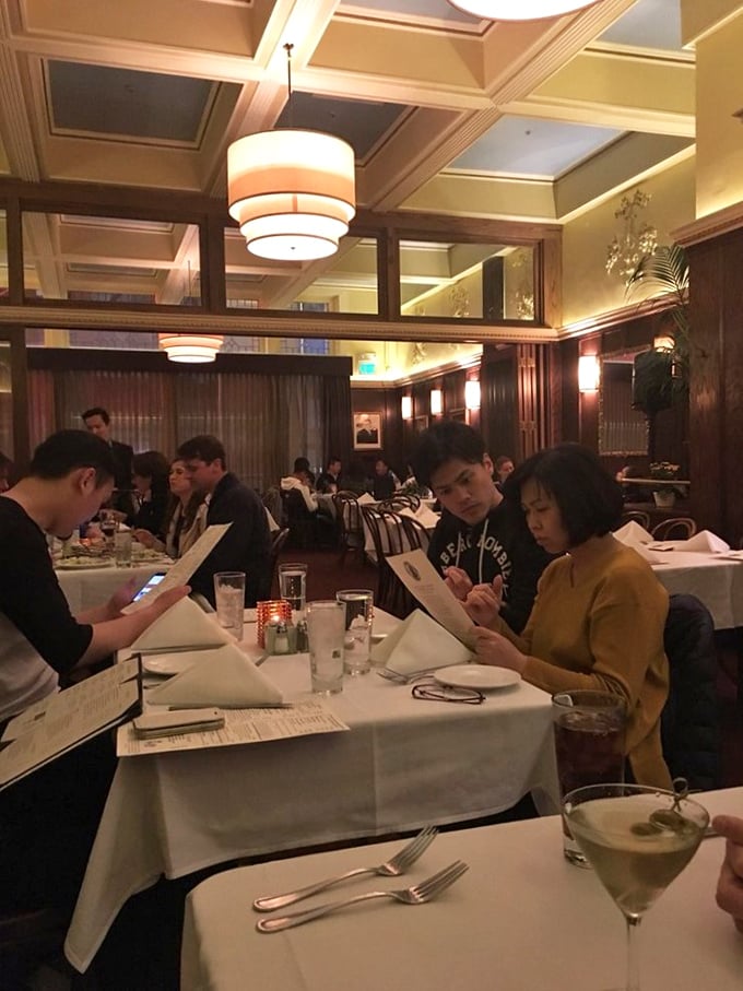 Diners lost in the ritual of great food and conversation &ndash; the true magic of John's Grill happens between bites.