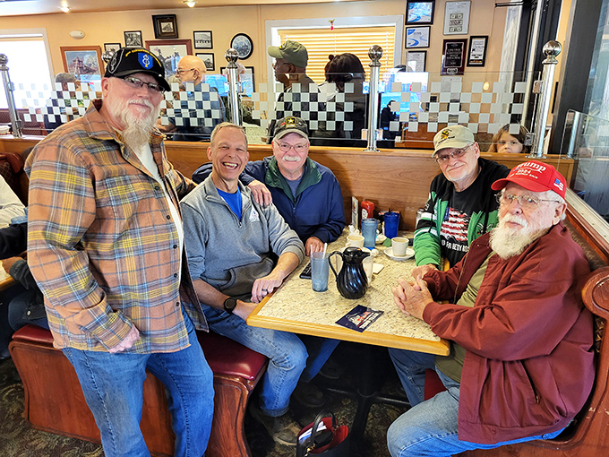 The true measure of any great diner: regulars who've claimed their booth with the confidence of homesteaders staking territory.