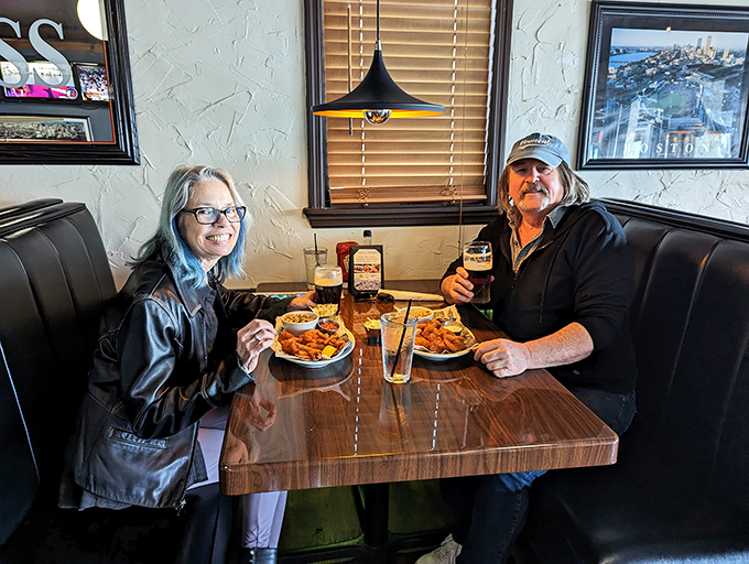 Happy diners diving into their seafood feast &ndash; their expressions confirming that sometimes the best souvenirs are culinary memories.