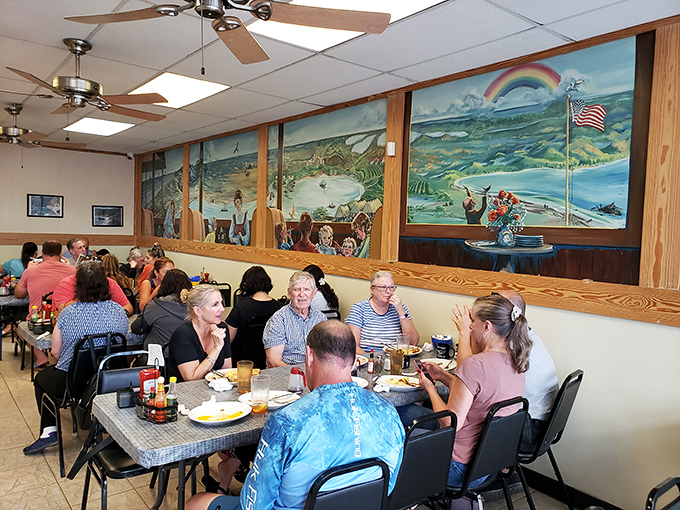 Where locals gather to solve the world's problems over eggs and toast, beneath murals that celebrate Florida's coastal heritage.
