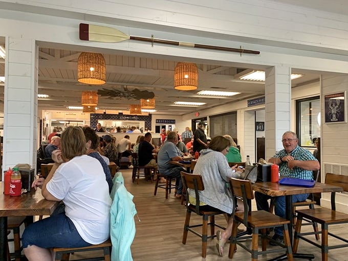 A bustling dining room filled with locals and visitors alike, all united in the universal language of "pass the tartar sauce."