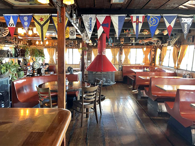Nautical flags and wooden booths create the perfect seafaring atmosphere. Like dining in the captain's quarters, if the captain had excellent taste in comfort food.