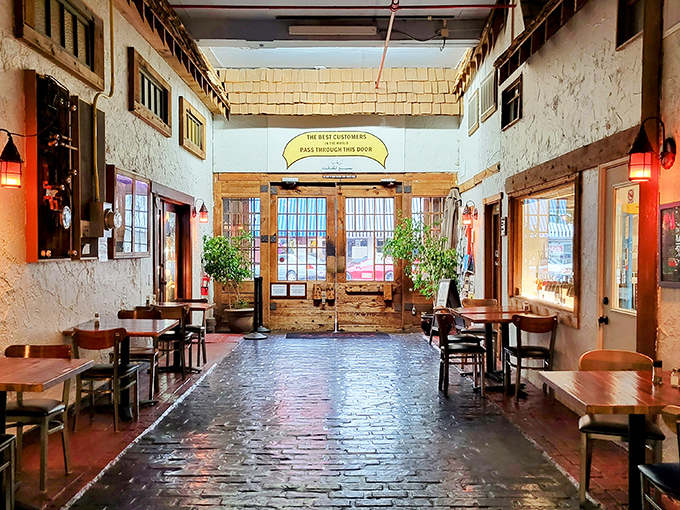 The dining area's brick floor and textured walls create an atmosphere where conversations flow as easily as the local brews.