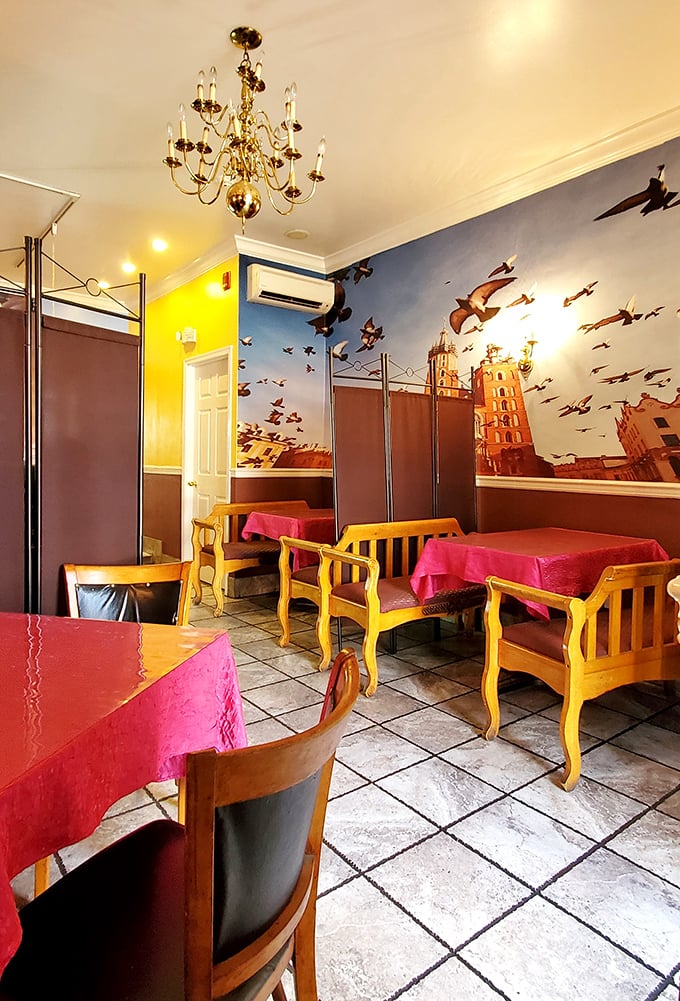 Cheerful yellow chairs and pink tablecloths create a dining room that's as warm and inviting as Sunday dinner.