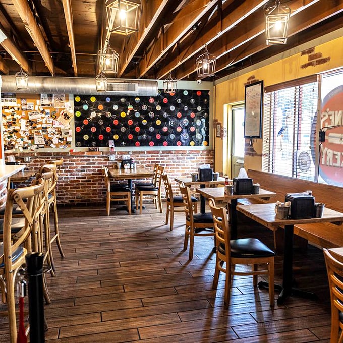 Exposed brick, wooden beams, and vinyl records on the wall&mdash;this isn't just decoration, it's a time machine disguised as a dining room.
