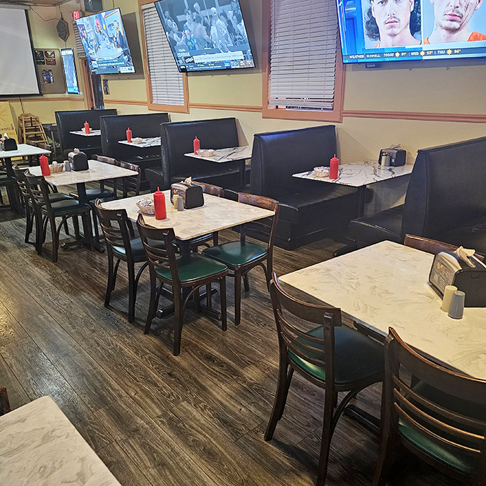 Booth seating and TVs create the perfect spot for lingering over lunch or settling in for a satisfying dinner experience.