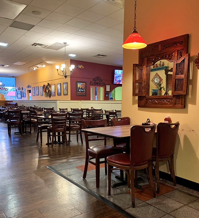 The dining room strikes that perfect balance between spacious and intimate. Those pendant lights cast the kind of glow that makes everyone look like they're having the time of their lives.